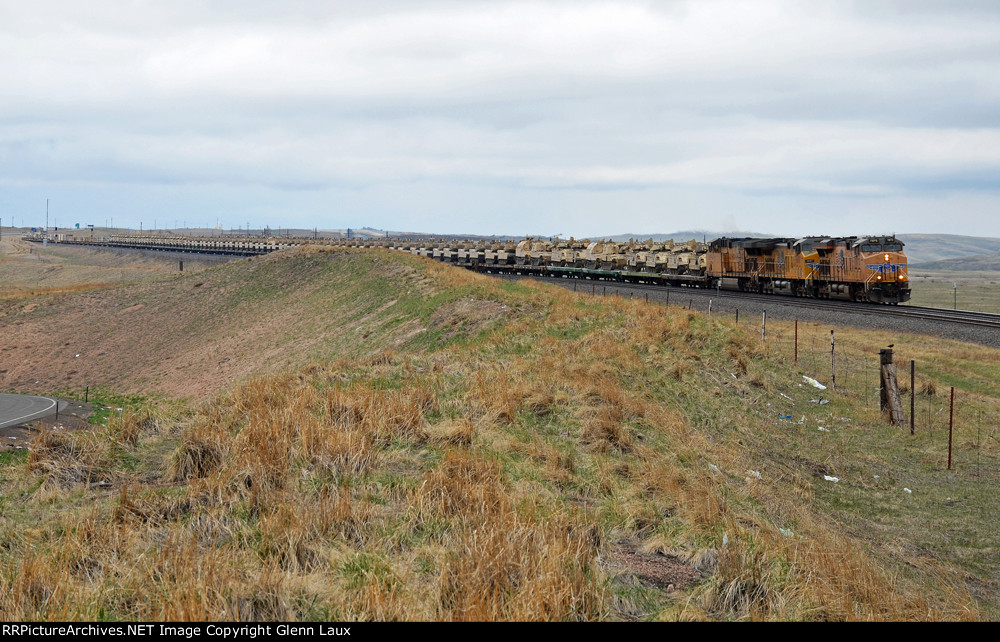 UP 7875, 6687 and 6894 lead an eastbound military train towards Cheyenne